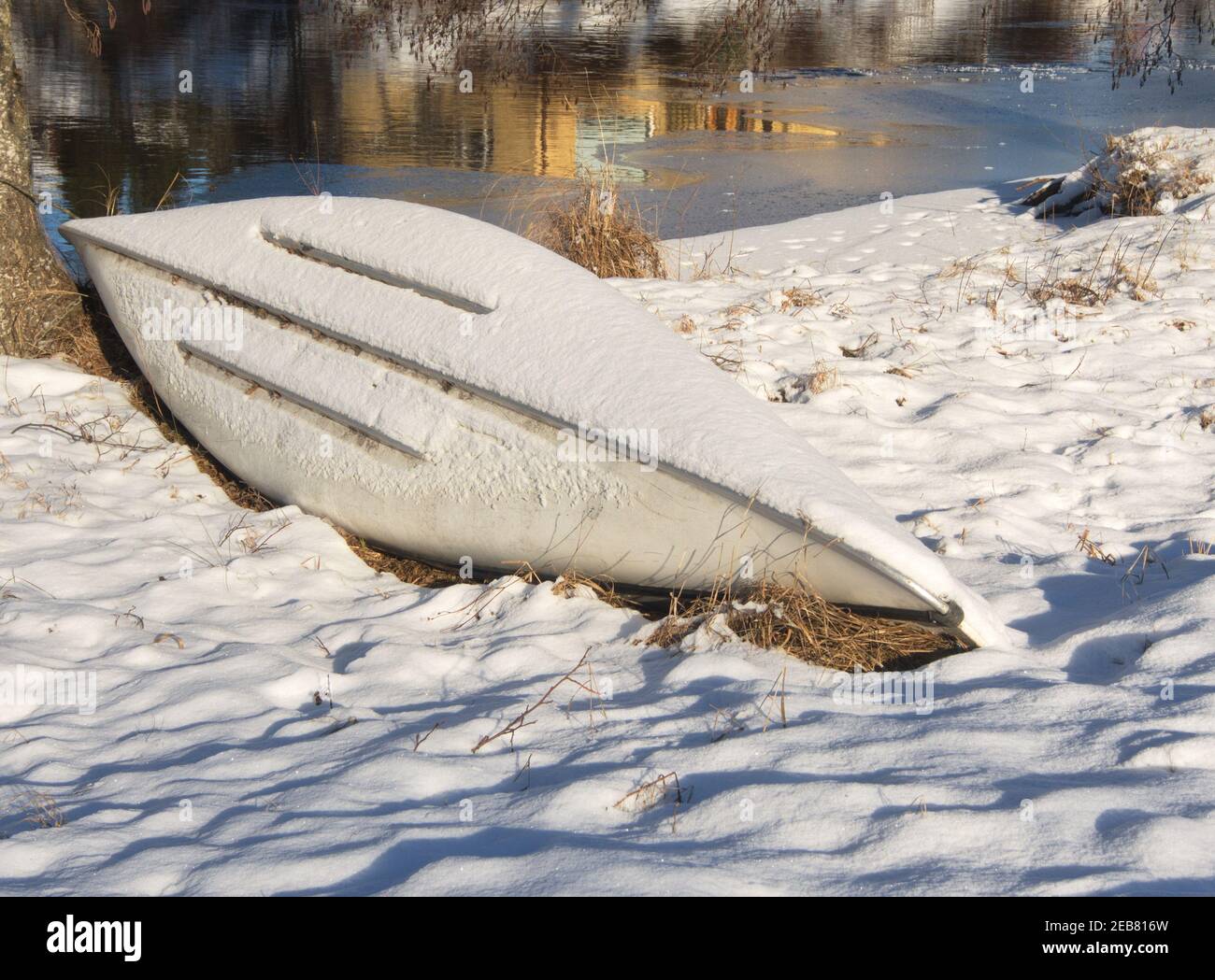 Canoe in snow Stock Photo - Alamy