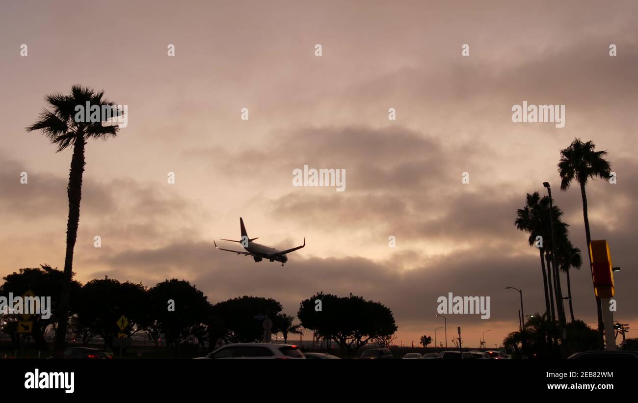 Airplane landing in LAX airport at sunset, Los Angeles, California USA ...