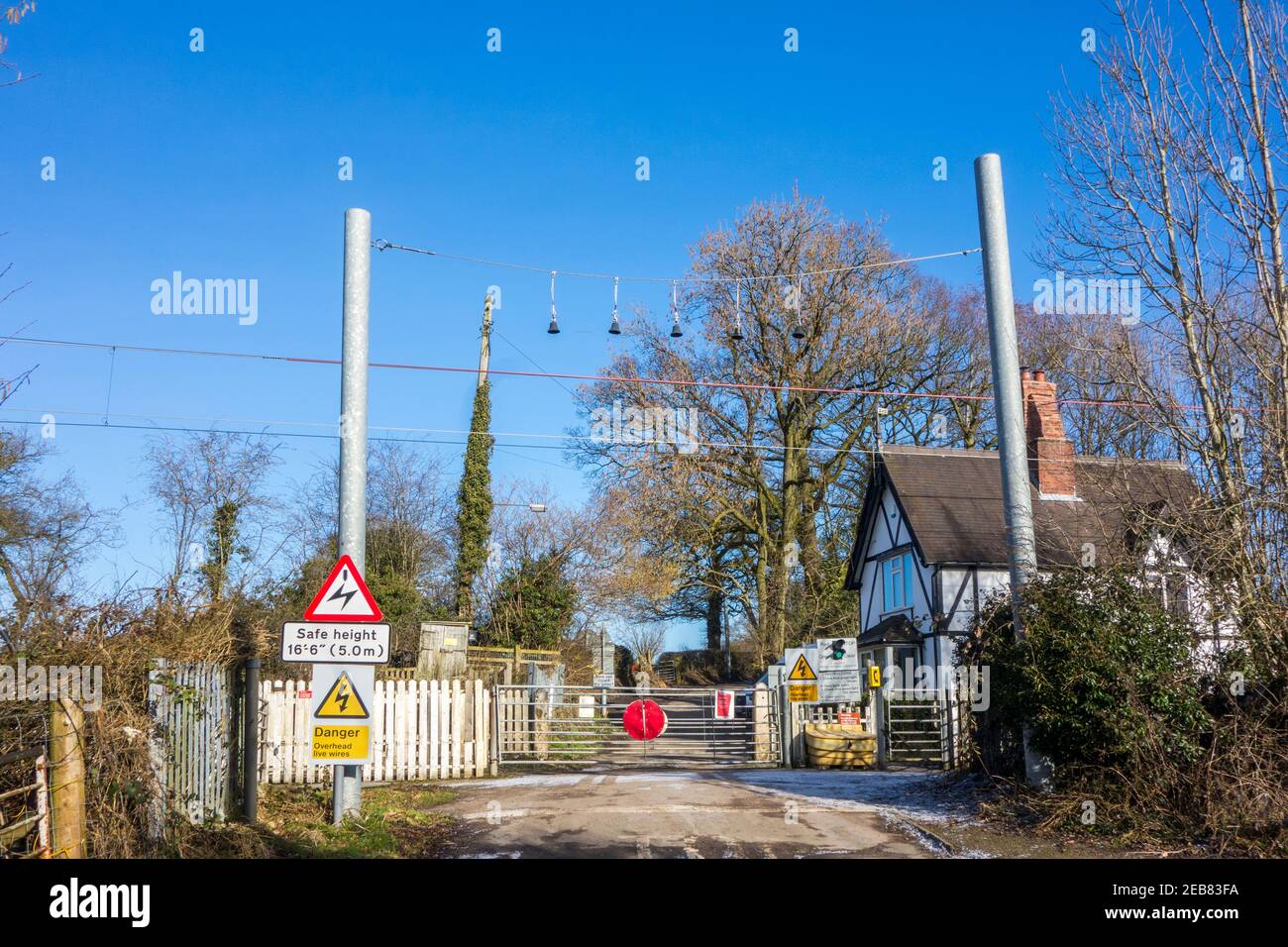 Rural countryside railway level crossing with manually operated gate to ...