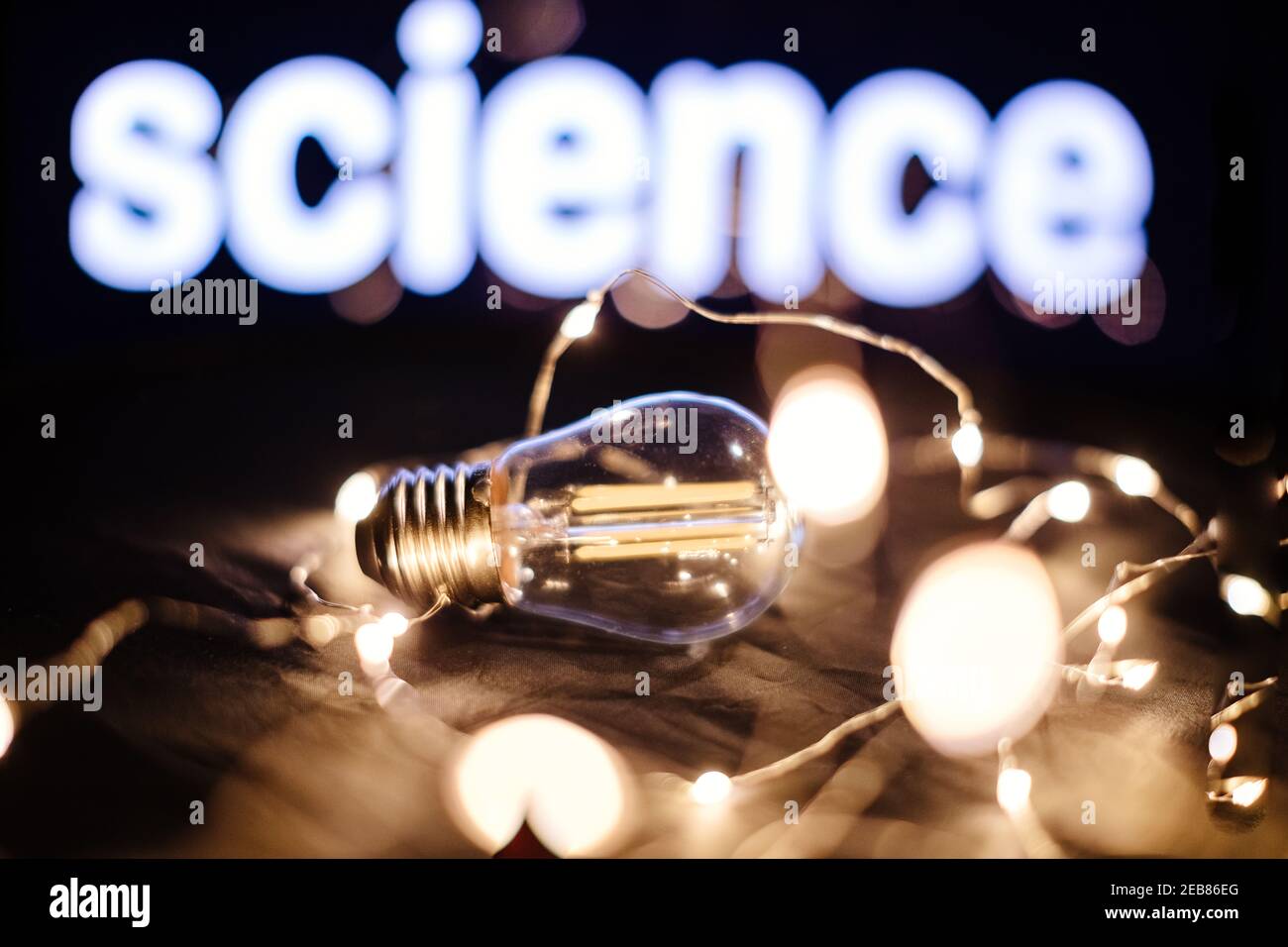 science light filament idea background Stock Photo - Alamy