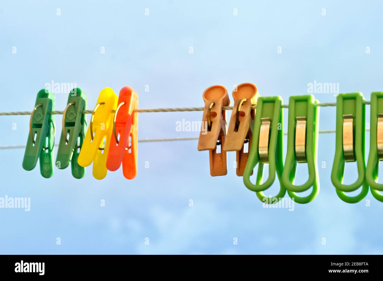 different laundry clothespins of color plastic, with metal clamping ...
