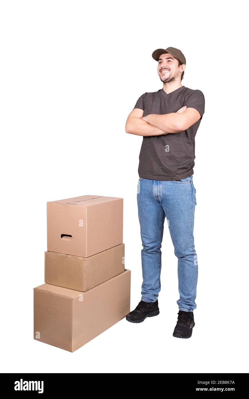 Young delivery man wearing cap, full length portrait, stands arm ...