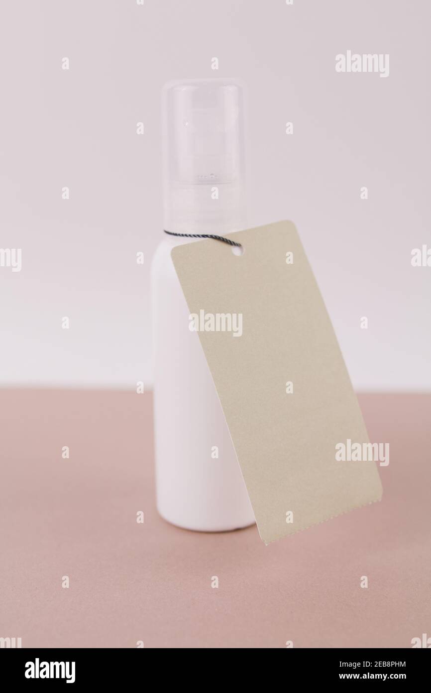 a blank price tag on white jar for shampoo or cosmetics on white ...