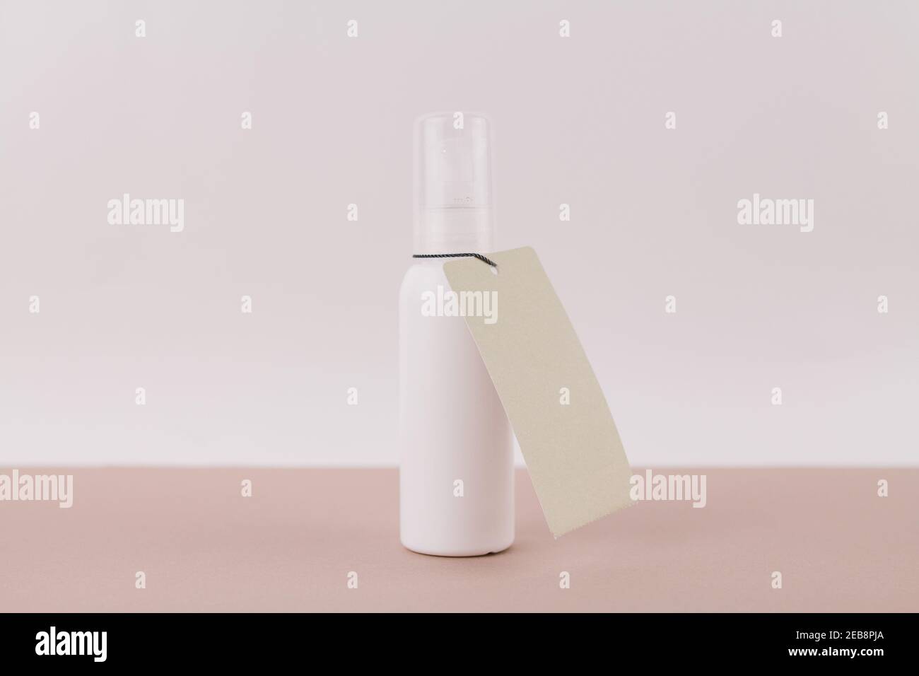 a blank price tag on white jar for shampoo or cosmetics on white ...