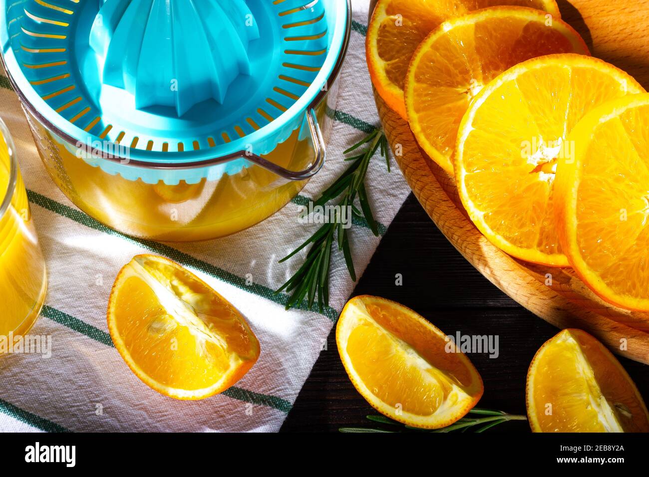 The process of making orange juice. Orange slices and juicer Stock ...
