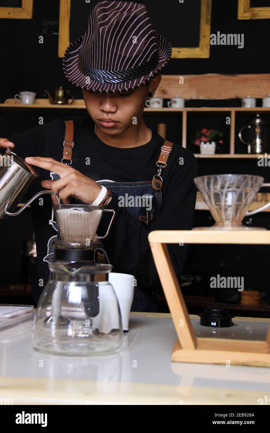 Indonesian Barista Prepare coffee drinks for customers at the coffee ...