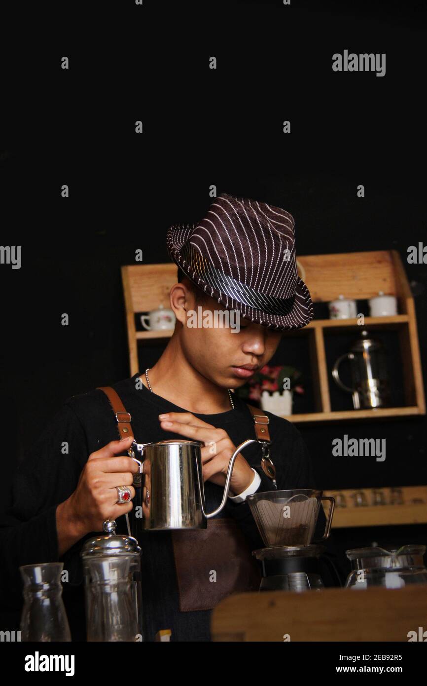 Indonesian Barista Prepare coffee drinks for customers at the coffee ...
