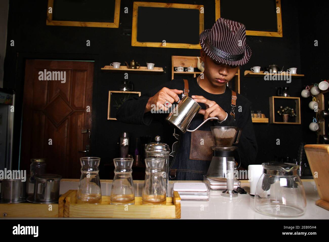 Indonesian Barista Prepare coffee drinks for customers at the coffee ...