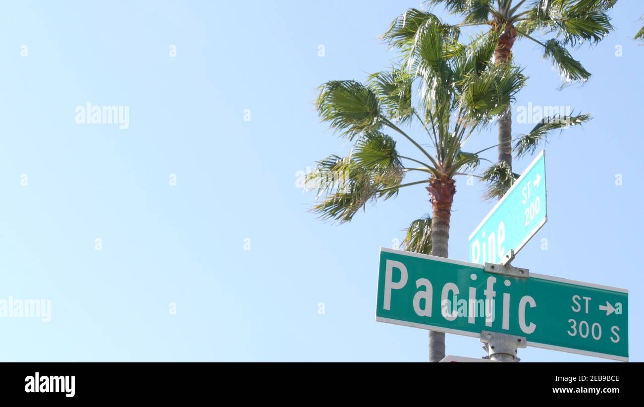 Pacific street road sign on crossroad, route 101 tourist destination ...
