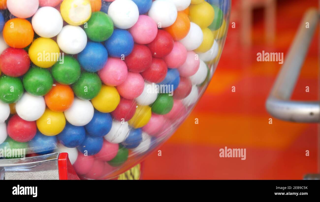 Colorful gumballs in classic vending machine, USA. Multi colored buble ...