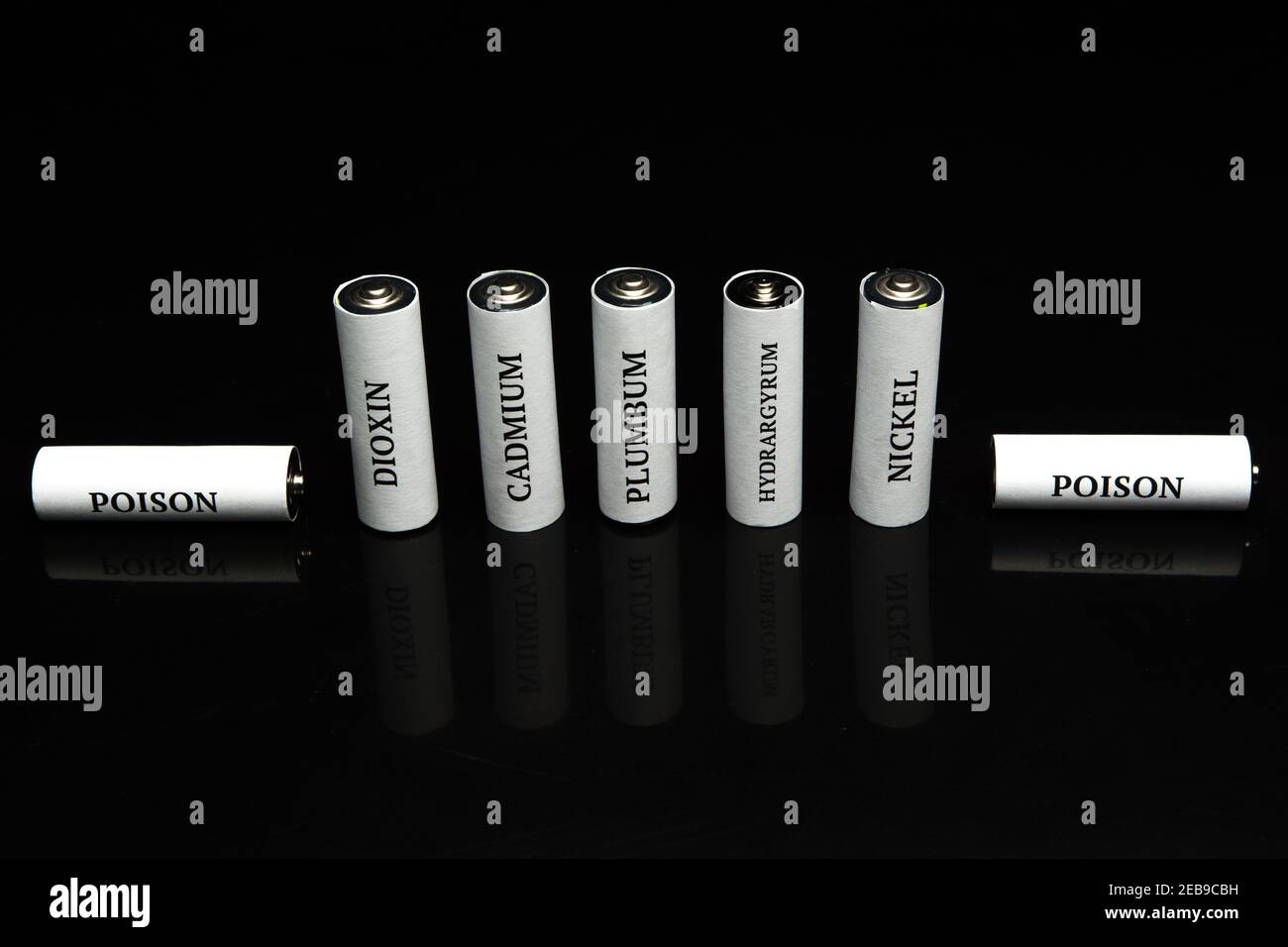 Battery on a black background. Battery for charging. Ecology. Harm to ...
