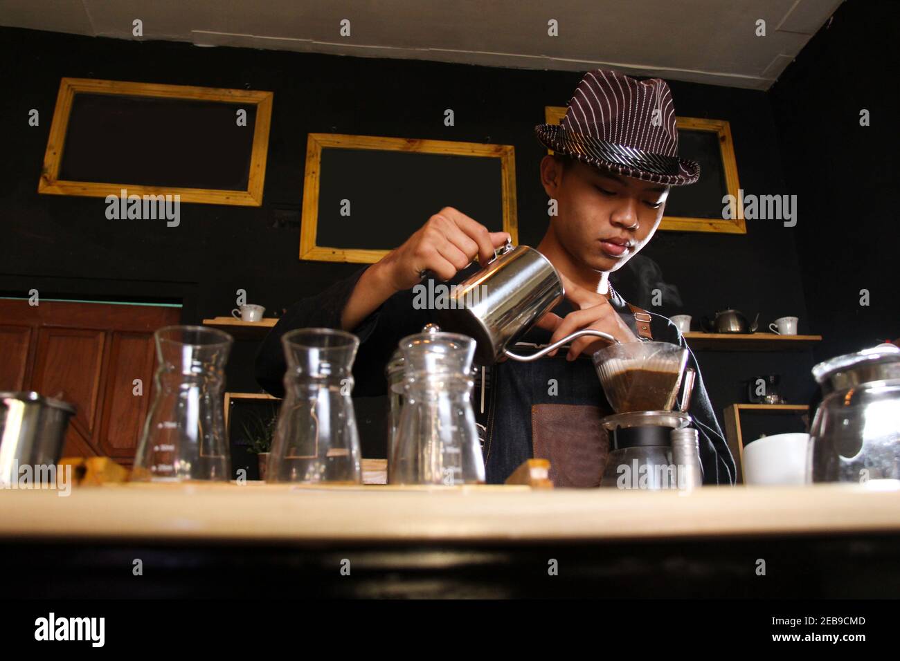 Indonesian Barista Prepare coffee drinks for customers at the coffee ...