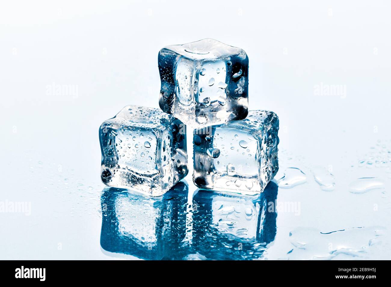 ice cubes on white background Stock Photo - Alamy