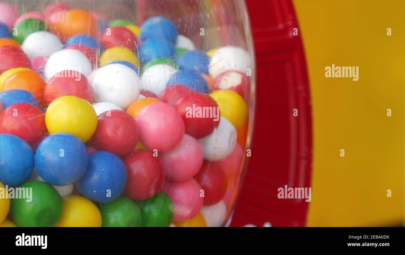 Colorful gumballs in classic vending machine, USA. Multi colored buble ...