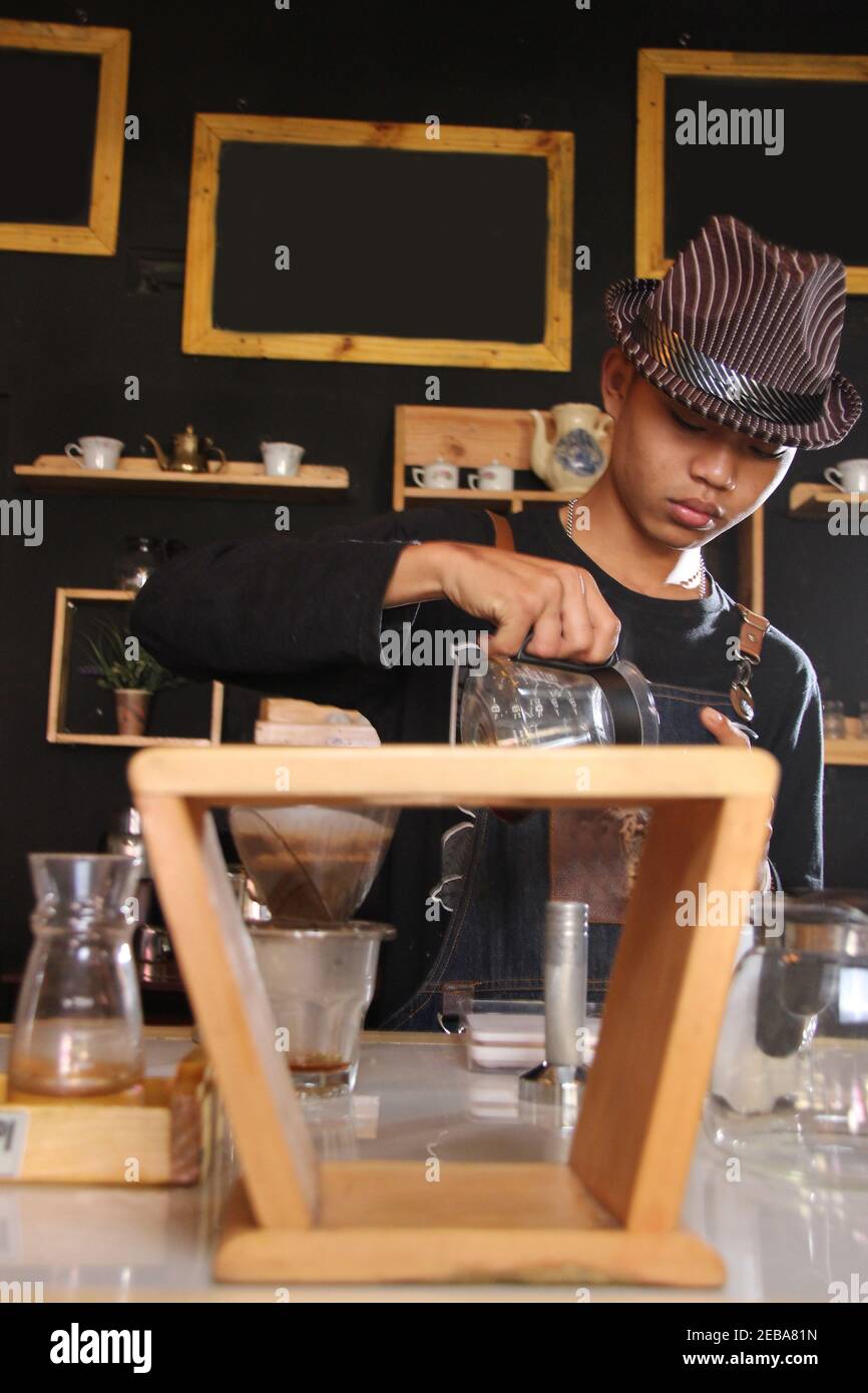 Indonesian Barista Prepare coffee drinks for customers at the coffee ...