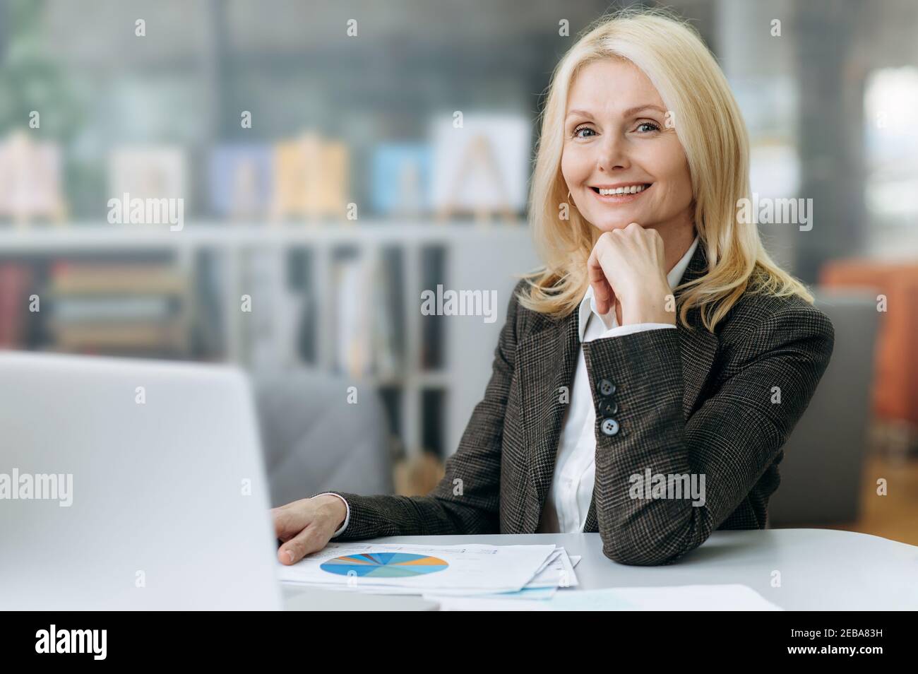 Portrait of successful middle aged business woman, ceo or manager in ...