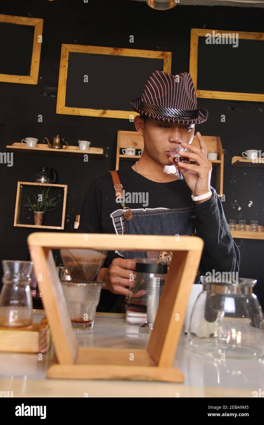 Indonesian Barista Prepare coffee drinks for customers at the coffee ...