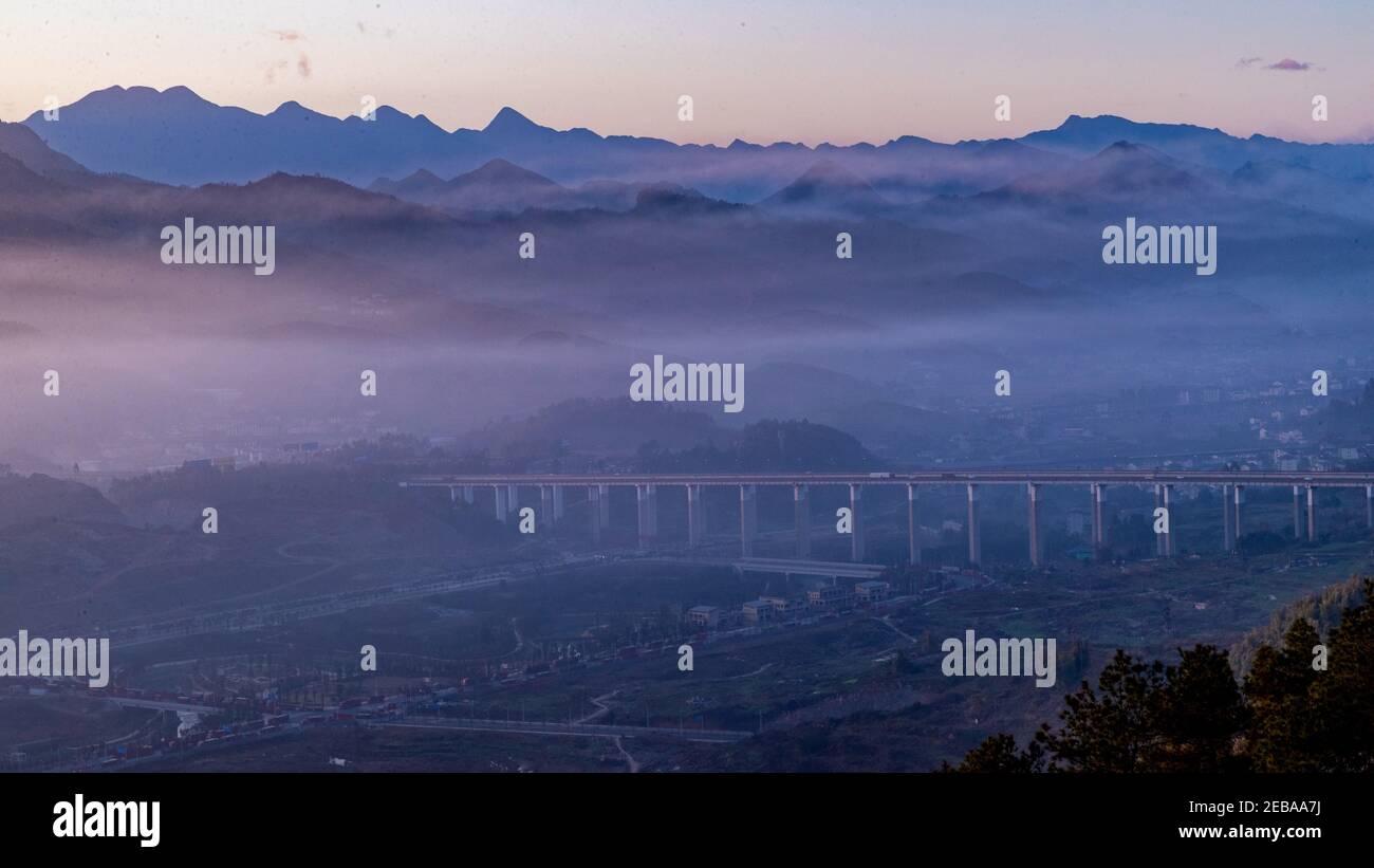 CHONGQING, CHINA - FEBRUARY 12, 2021 - Thin fog wraps around Nanchuan ...
