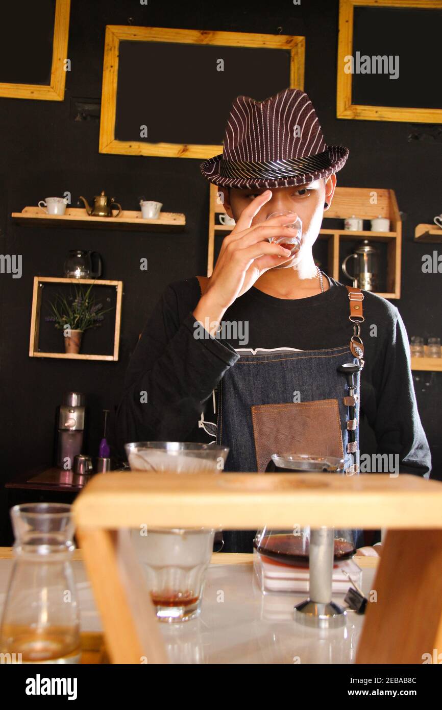 Indonesian Barista Prepare Coffee Drinks For Customers At The Coffee