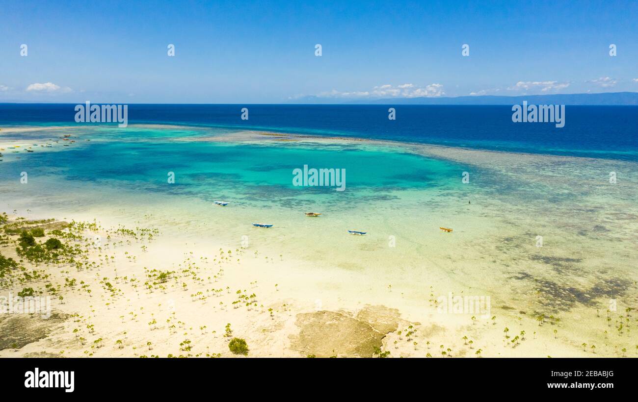 Aerial view of Lagoon with turquoise water and boats. Coral reef and ...