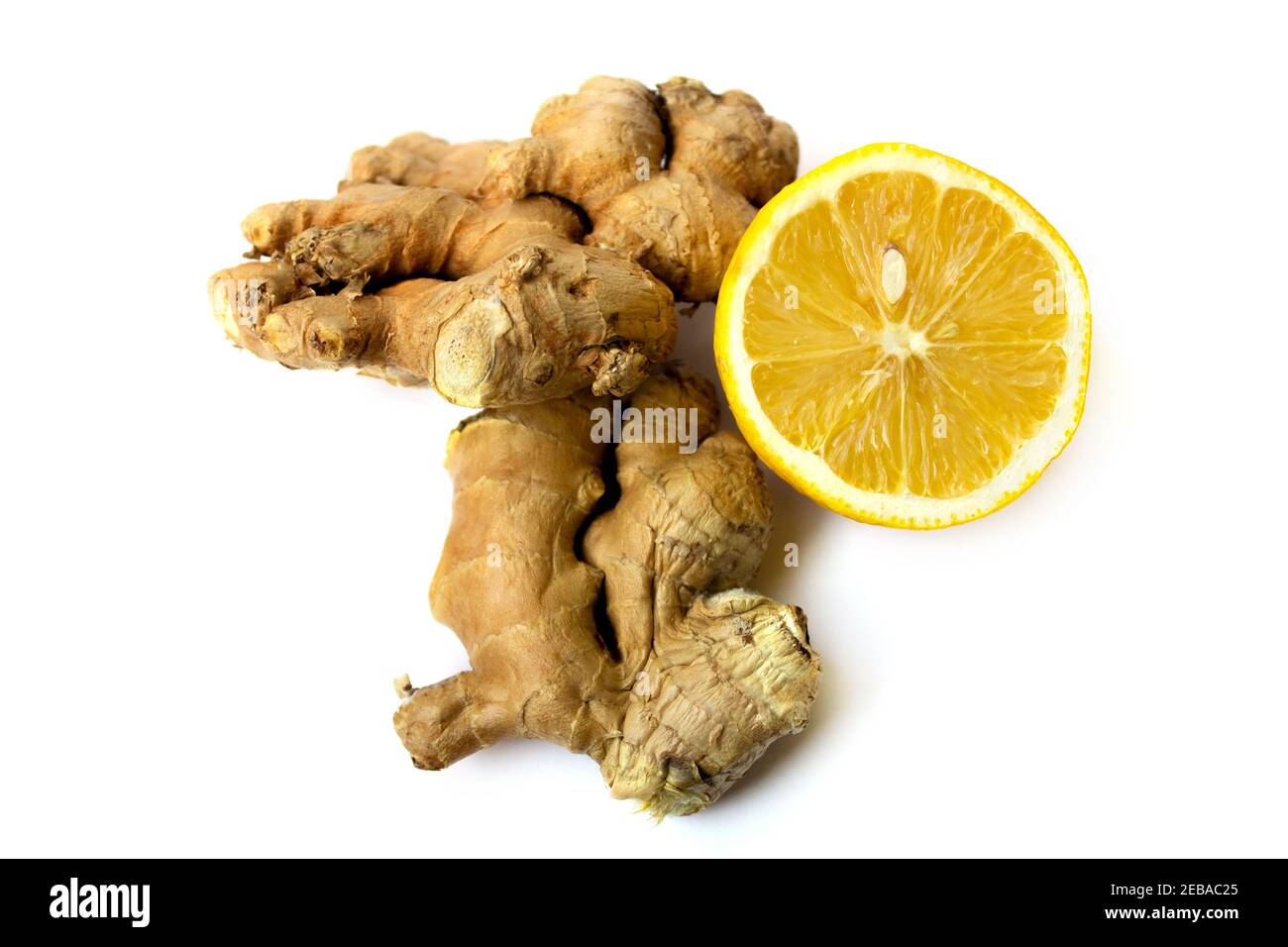 root ginger with lemon on a white background Stock Photo - Alamy