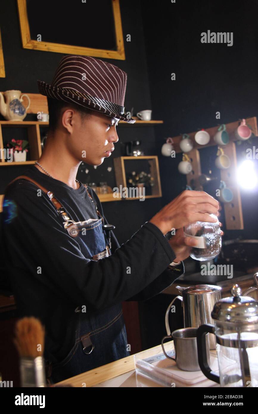 Indonesian Barista Prepare coffee drinks for customers at the coffee ...