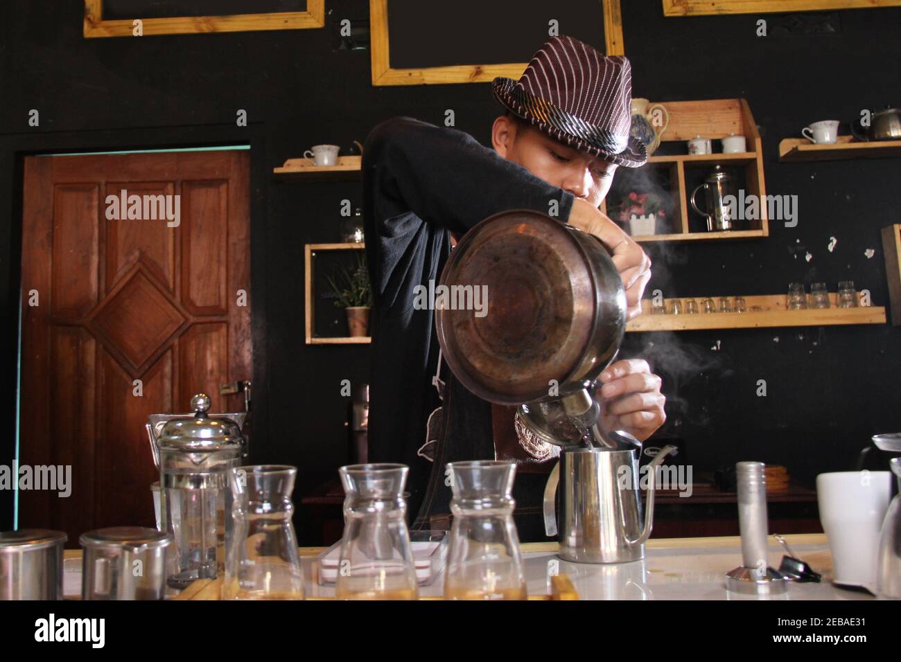 Indonesian Barista Prepare Coffee Drinks For Customers At The Coffee