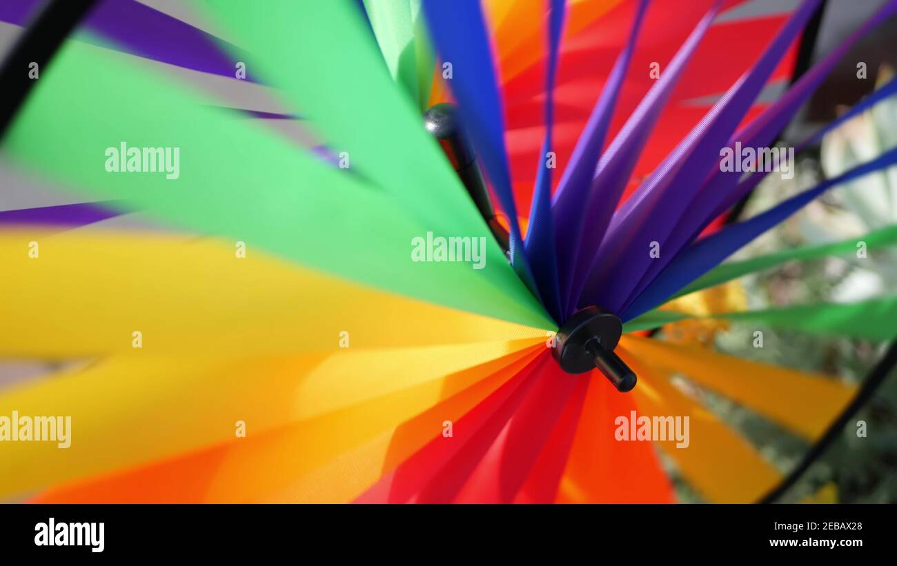 Colorful pinwheel spinning, weather wind vane, garden decoration in USA ...