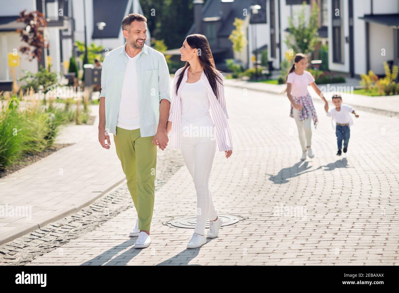 Full length body size view of four cheerful adorable people dad mom ...