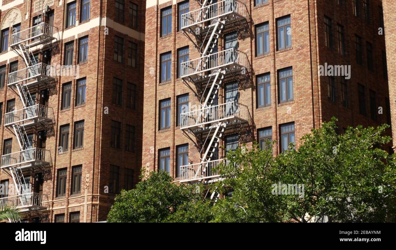 Fire escape ladder outside residential brick building in San Diego city ...