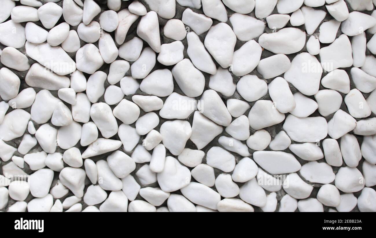 Group of white pebbles stone background and texture Stock Photo - Alamy