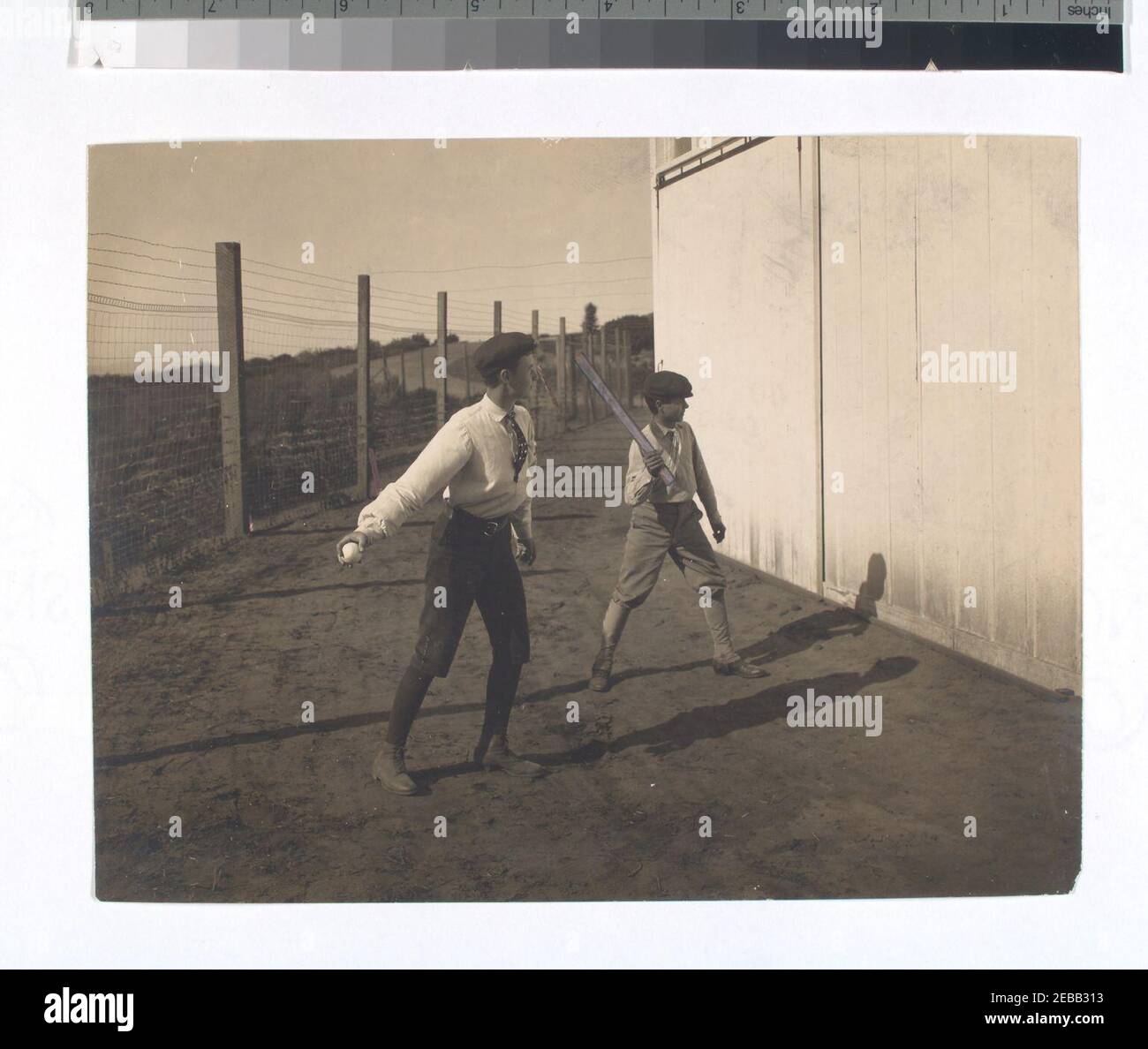 Fig. 3- Two boys with a ball and bat, playing Barn Ball Stock Photo - Alamy