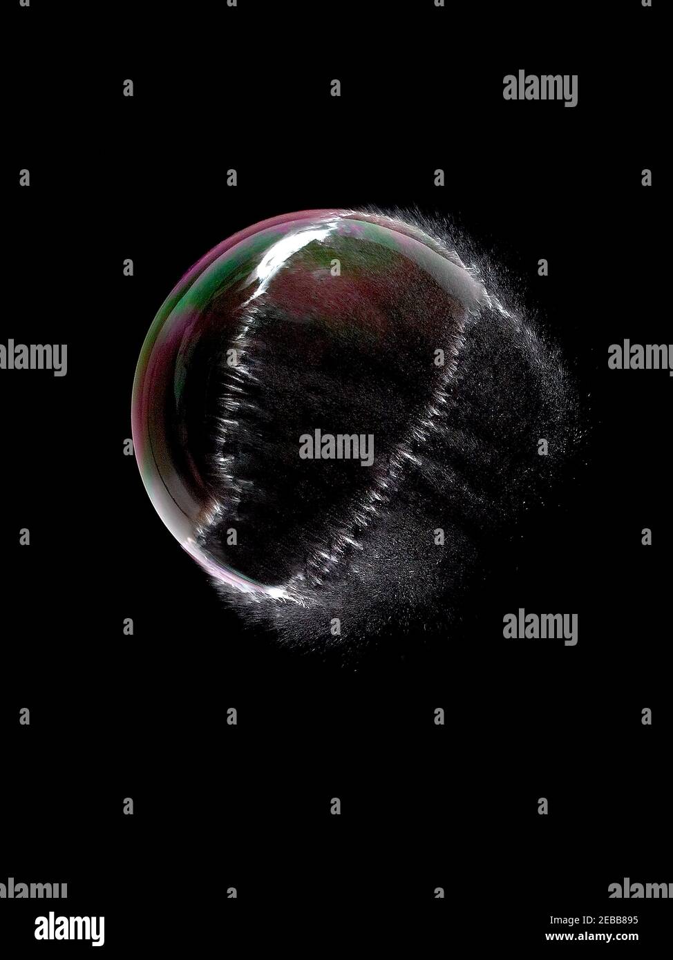 Popping Soap Bubble Exploding on Black Background Stock Photo - Alamy