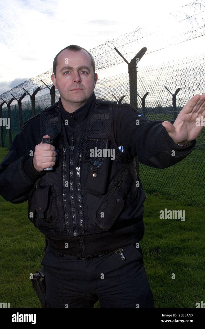 UK Police Officer using Incapacitant Spray Stock Photo - Alamy