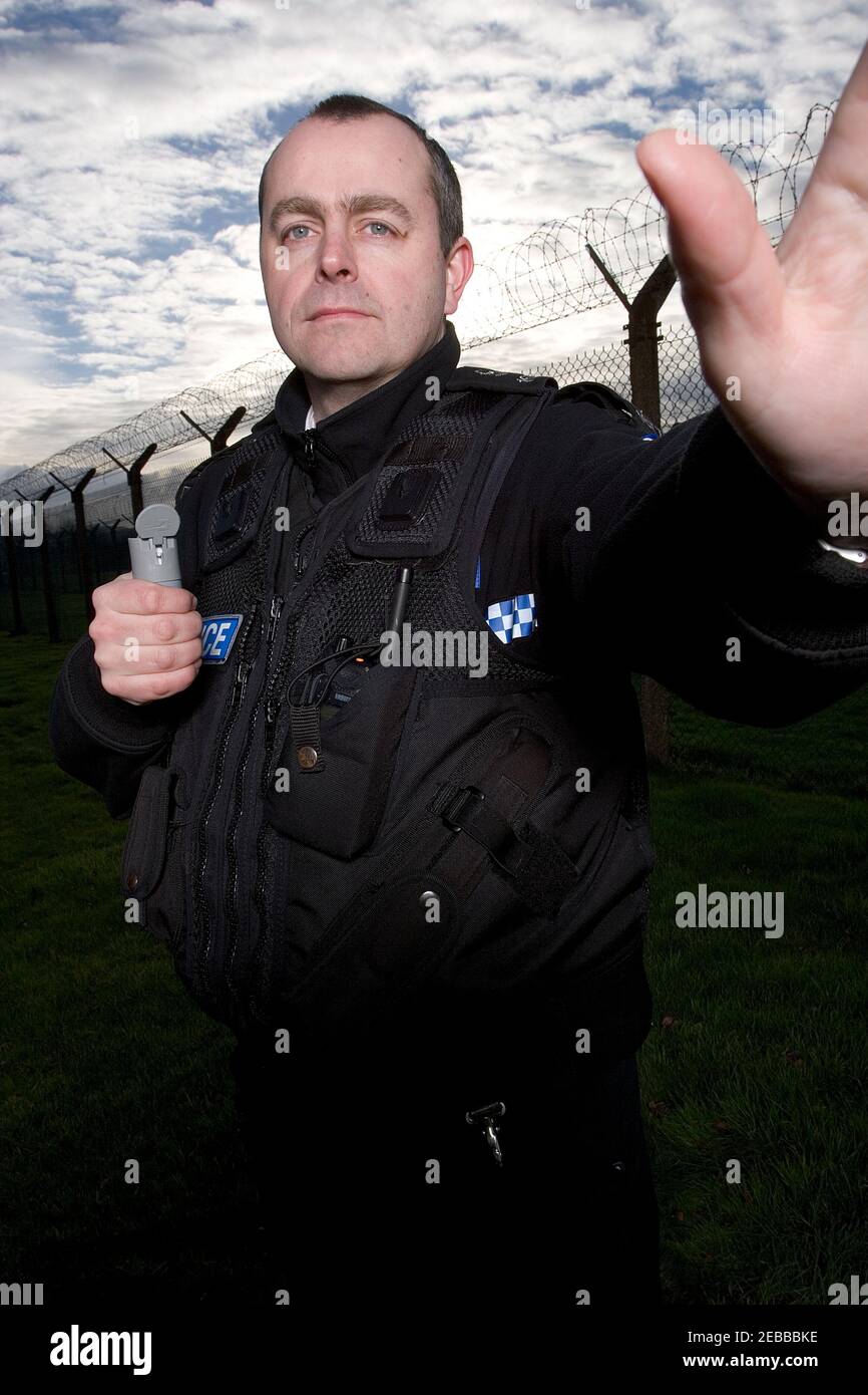 UK Police Officer using Incapacitant Spray Stock Photo - Alamy