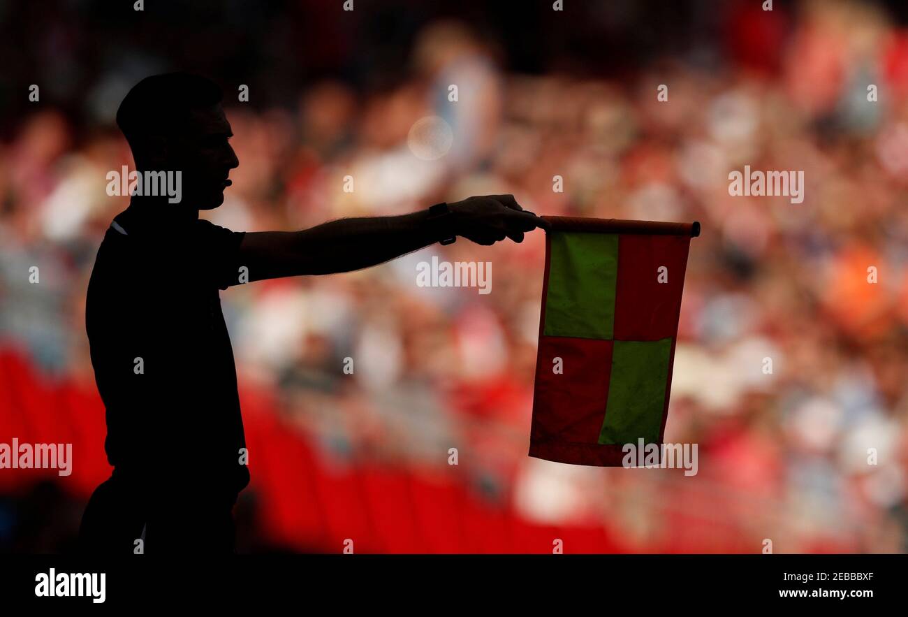 The assistant referee signals for an offside hi-res stock photography ...