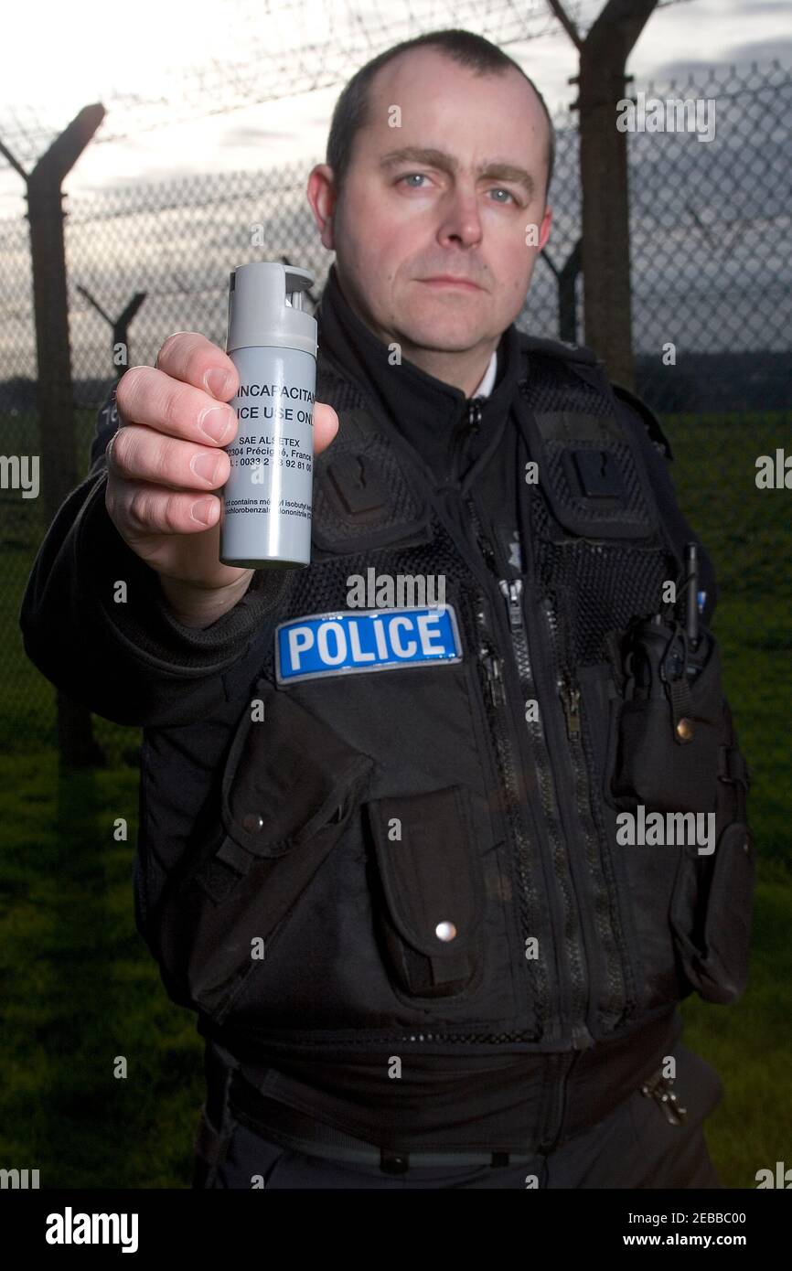 UK Police Officer using Incapacitant Spray Stock Photo - Alamy