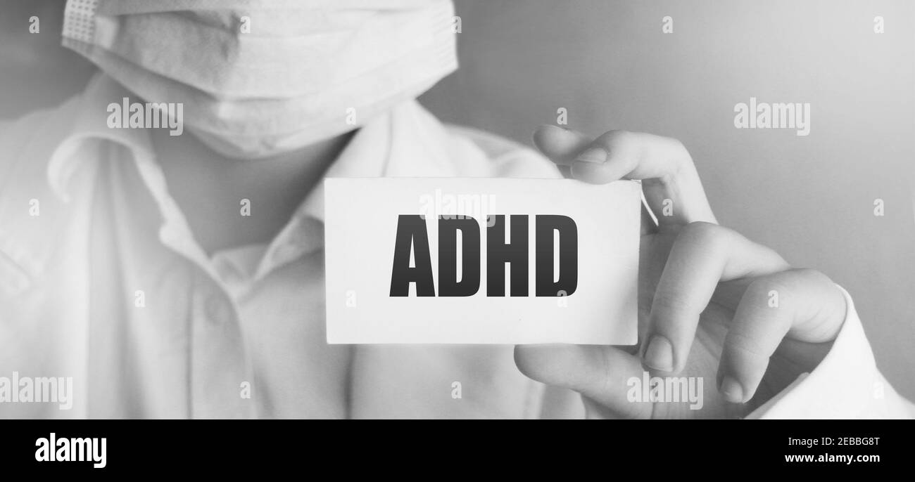Doctor keeps a card with the name of the diagnosis ADHD. Selective ...