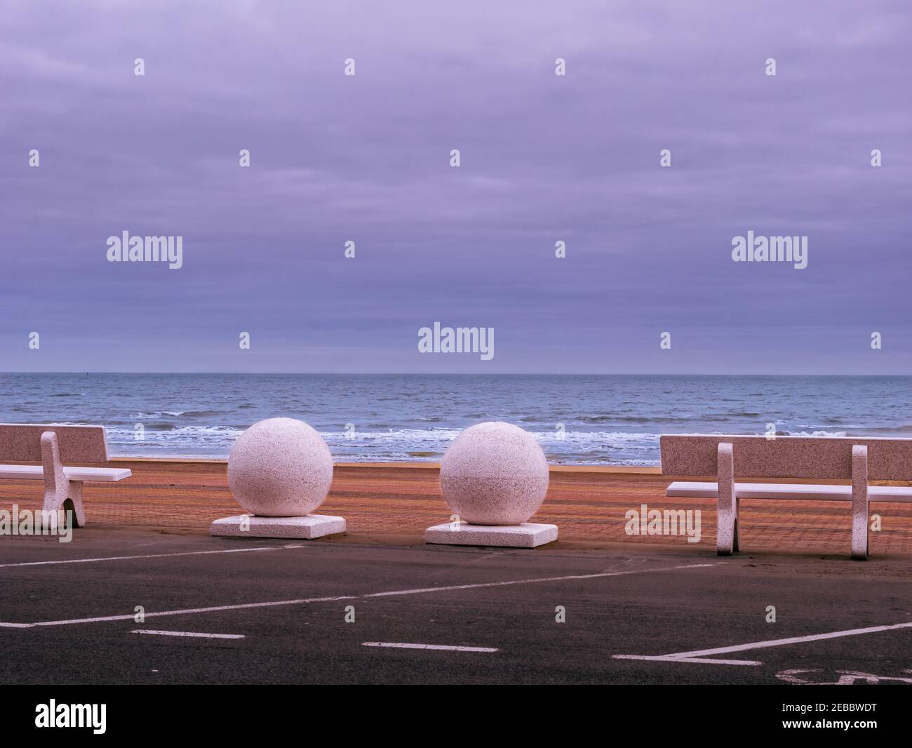 Beach promenade with marble benches and bowls Stock Photo - Alamy