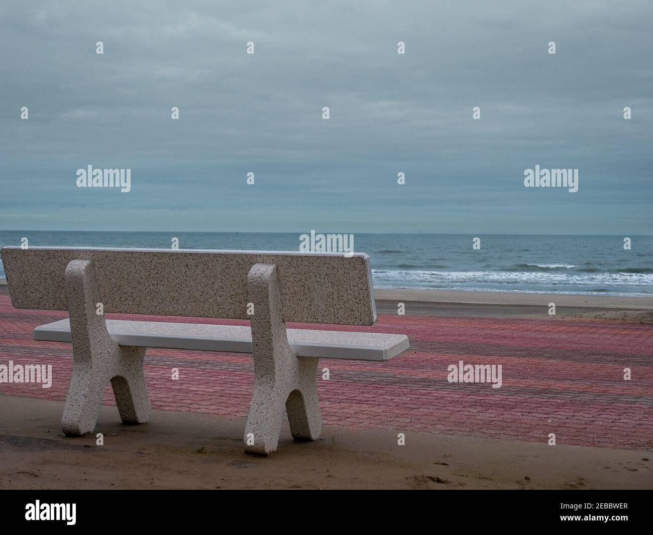 Beach promenade with marble bench Stock Photo - Alamy