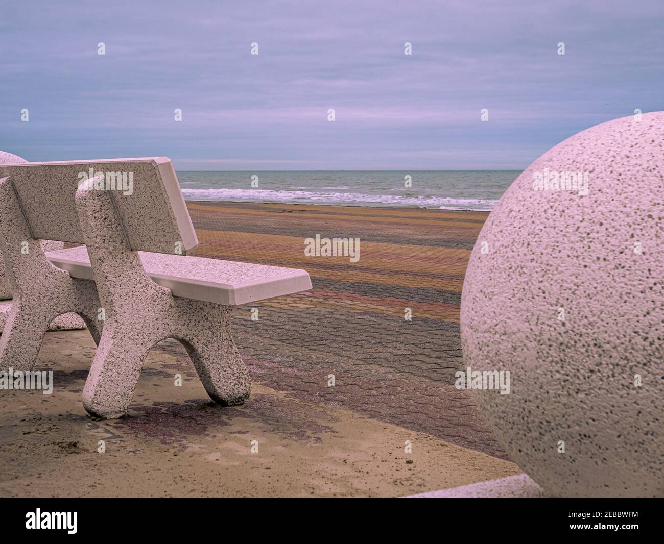 Beach promenade with marble bench and bowl Stock Photo - Alamy