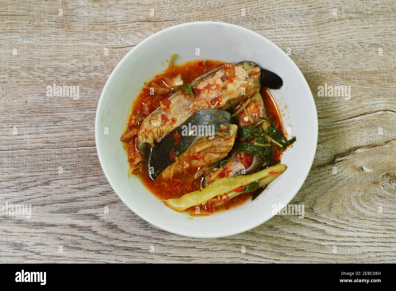 spicy fried catfish with finger root and chili in curry on bowl Stock ...