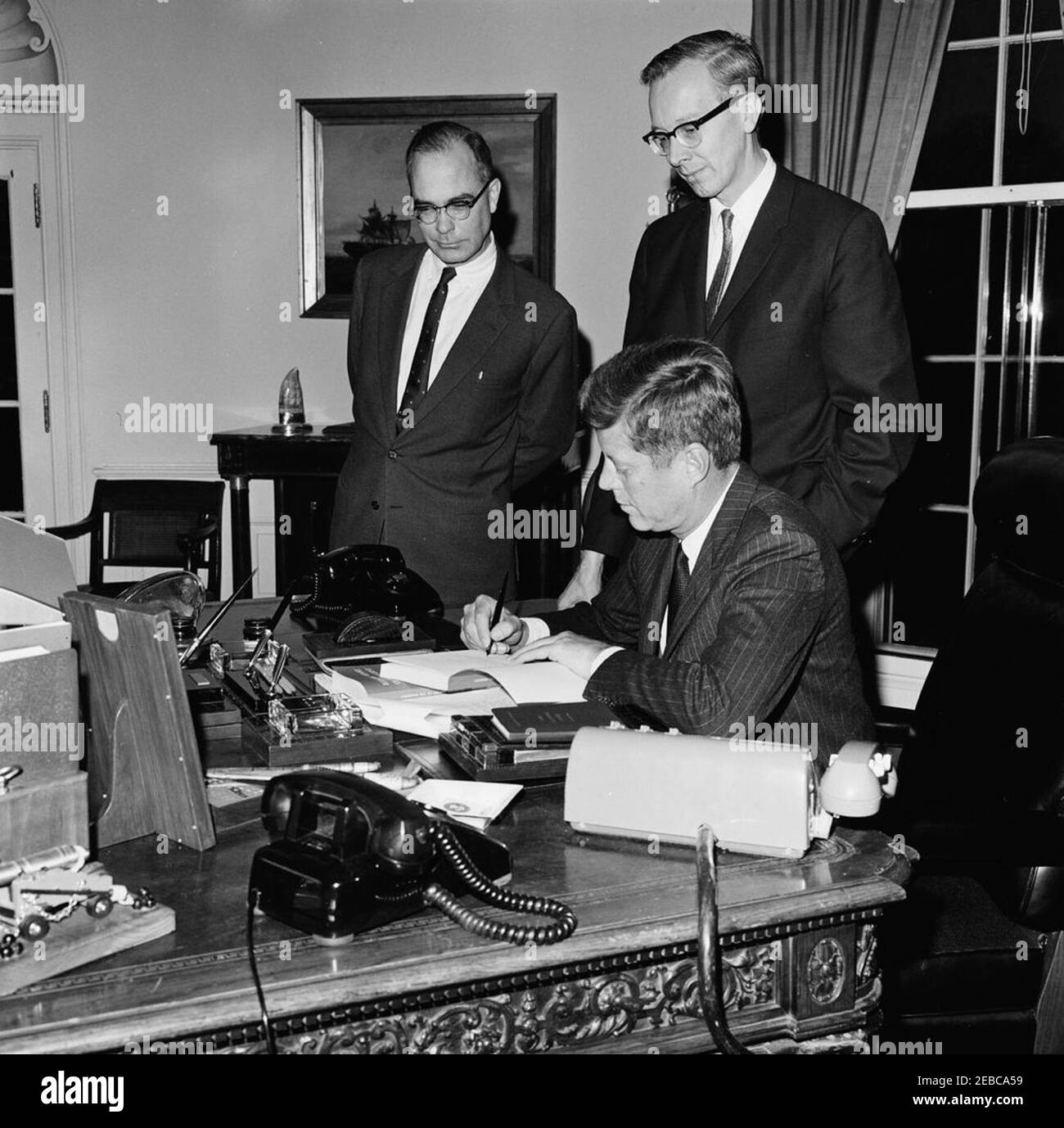Signing ceremony, Economic Message. President John F. Kennedy (seated ...