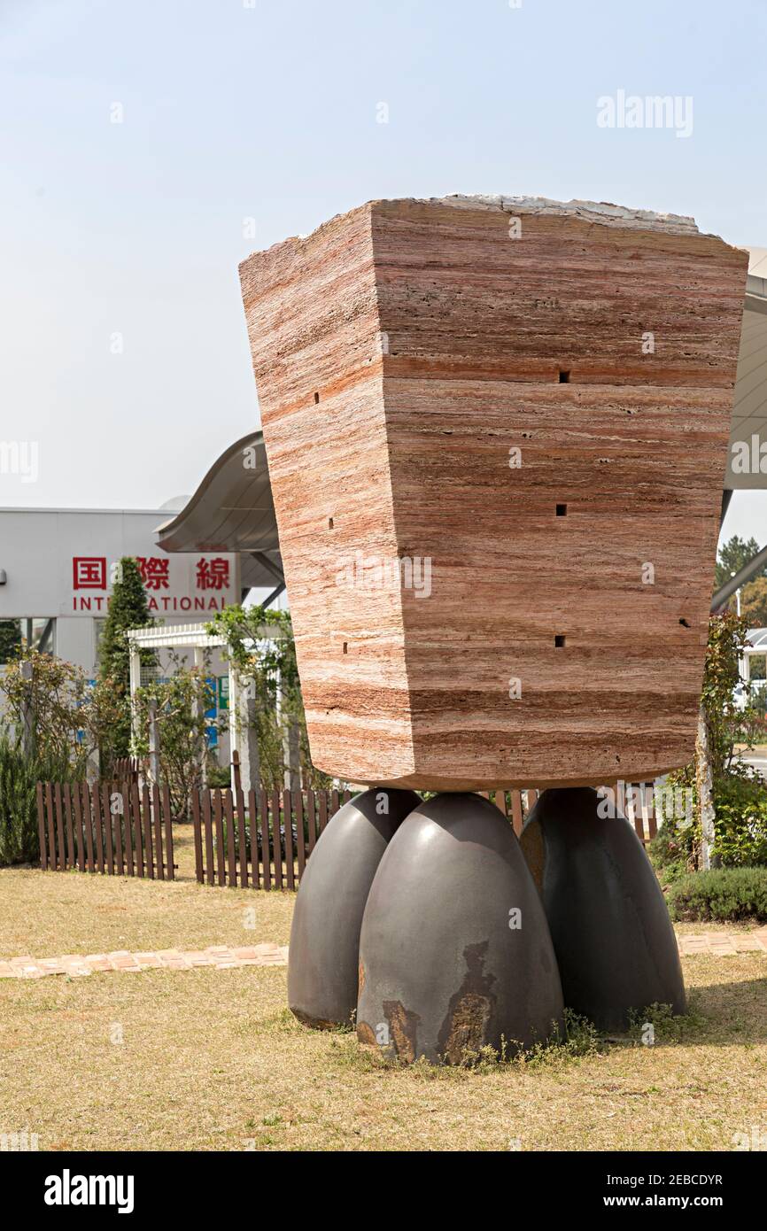 Layers of stone in cut block displayed as art, airport, Ube, Yamaguchi ...