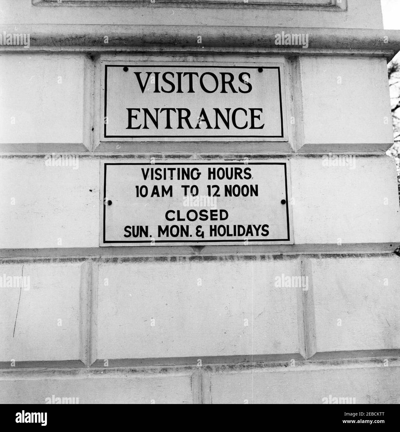 Visitors sign at East Lobby entrance. A visitors sign, with visiting ...