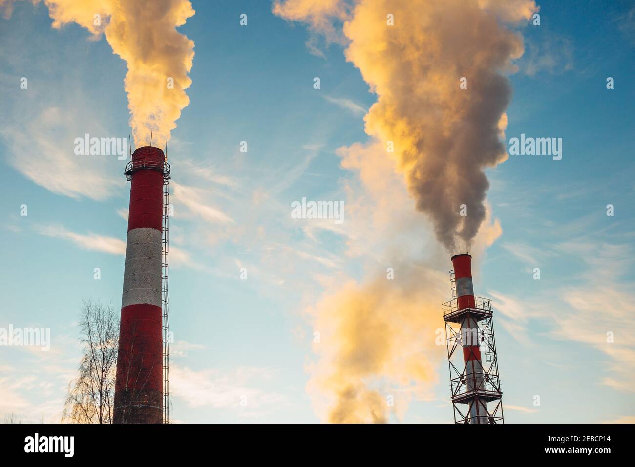 Toxic smoke from factory chimneys into a clear sky - oxygen pollution ...