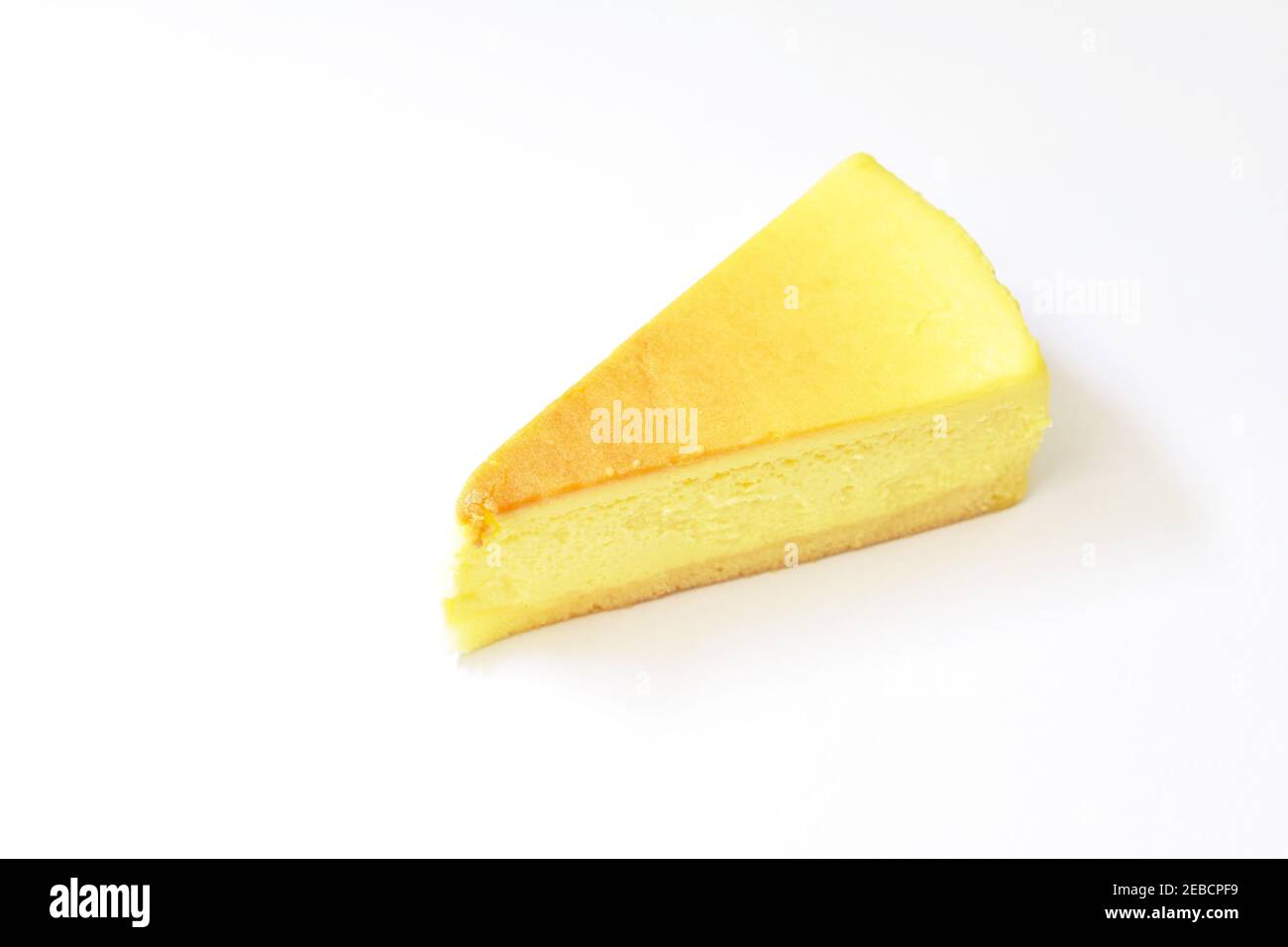 cheesecake cutting in triangle shape on white background Stock Photo ...
