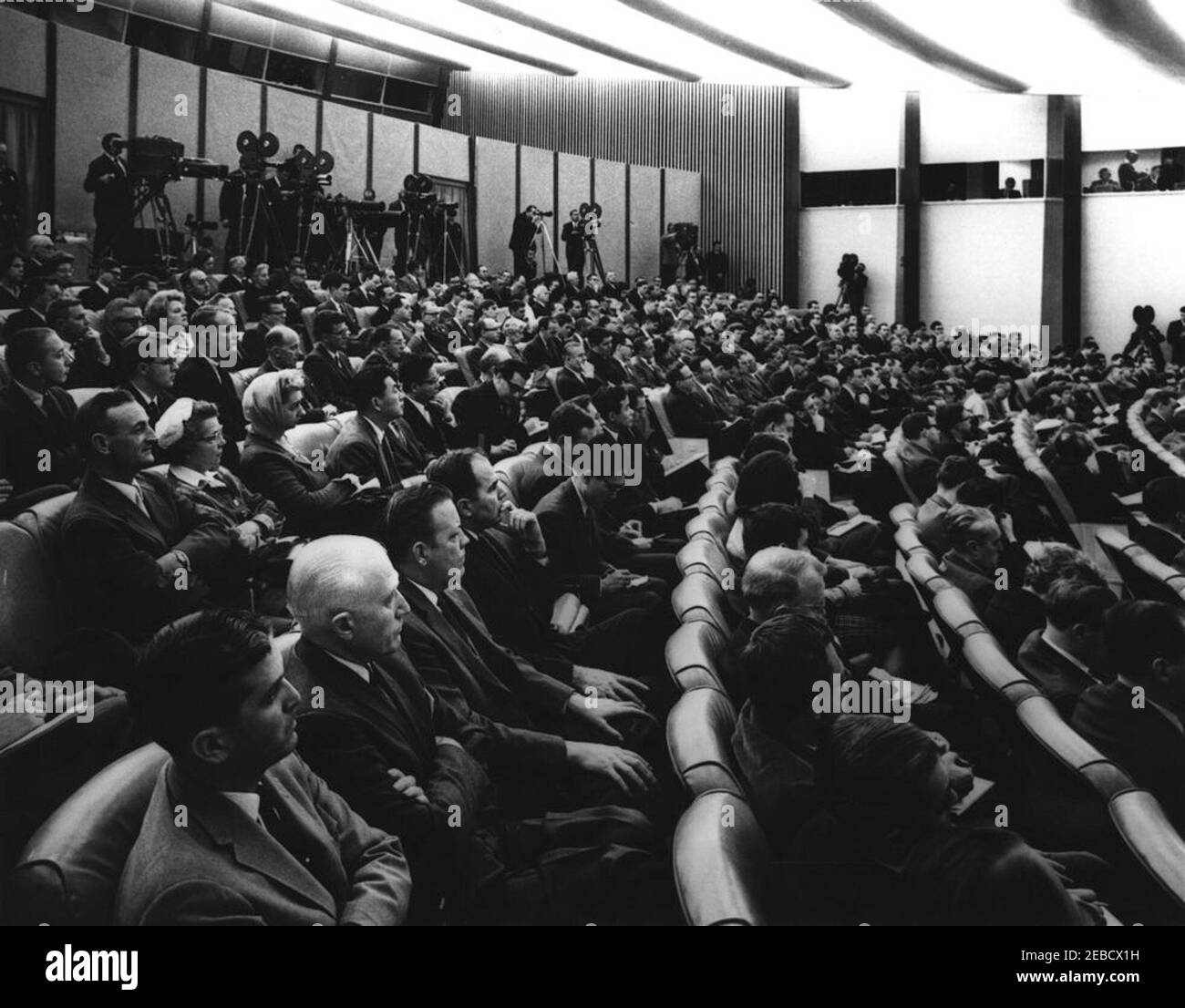 Press Conference, State Department Auditorium, 4:00PM. Audience listens ...