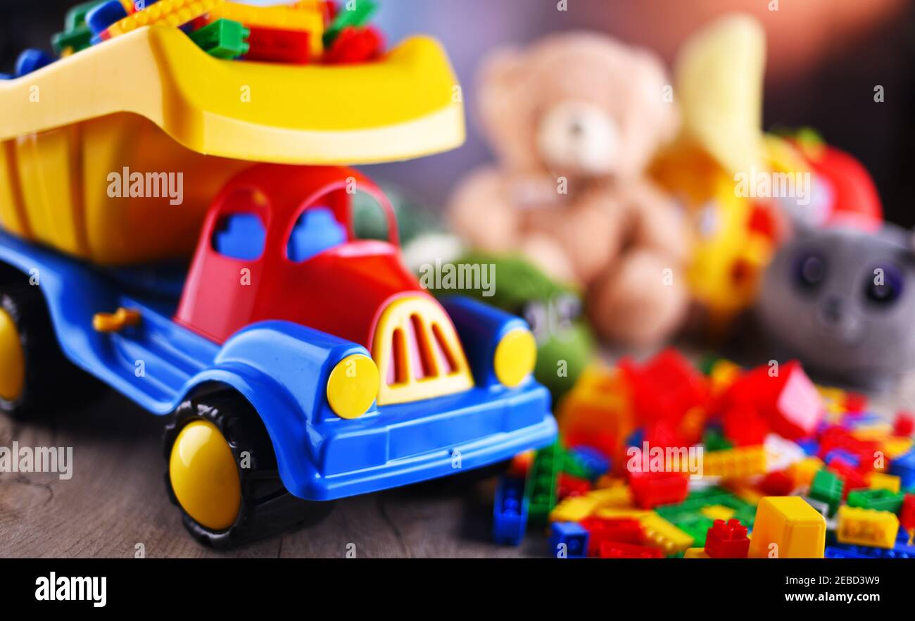 Colorful plastic and plush toys in a children's room Stock Photo - Alamy