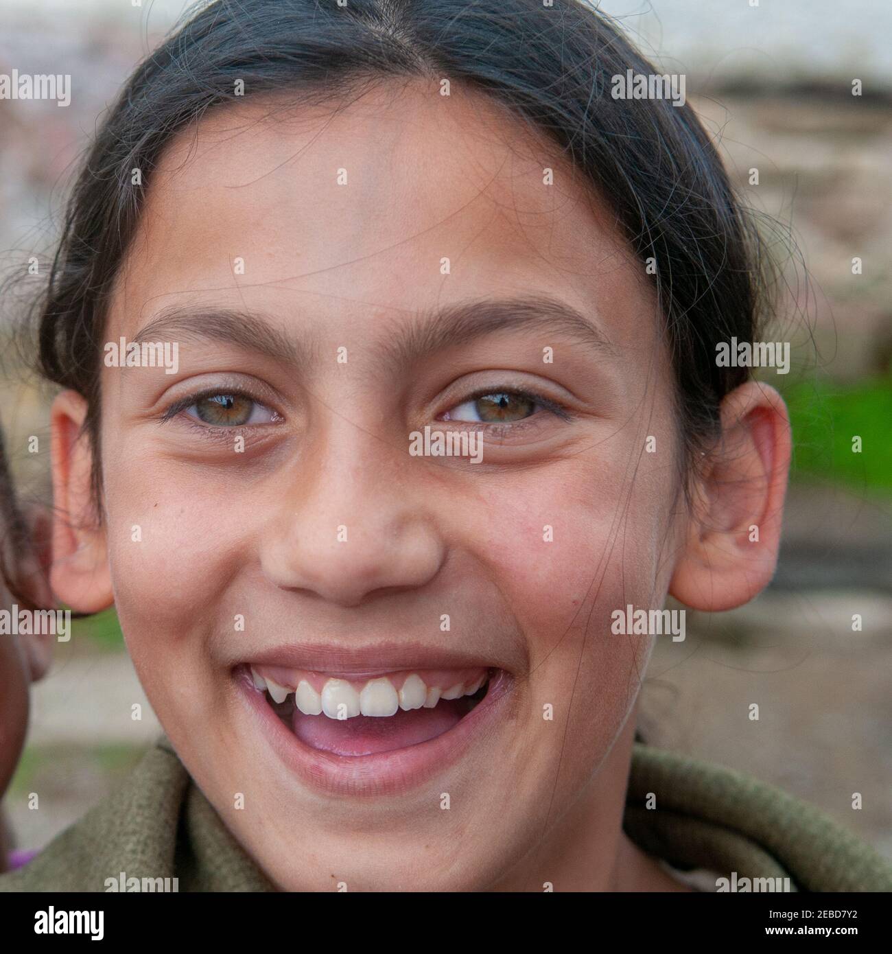 5-16-2018. Lomnicka, Slovakia. A close-up of Roma or Gypsy smiling girl ...